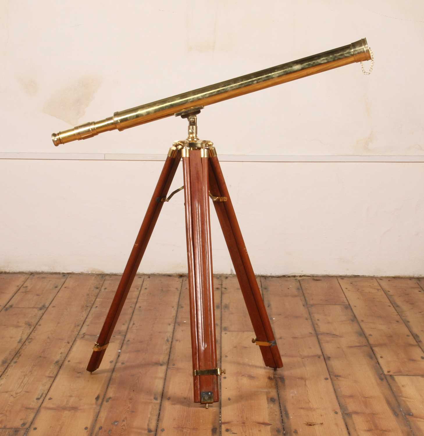 Lot 272 - A brass extending telescope, mounted upon a