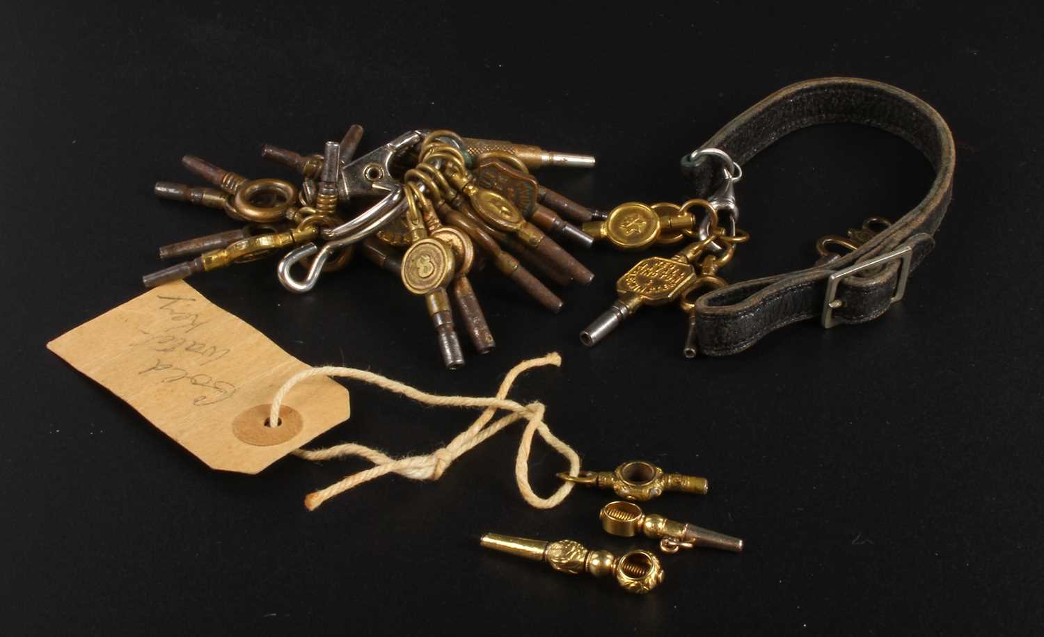 Lot 145 - A collection of various watch winding keys,