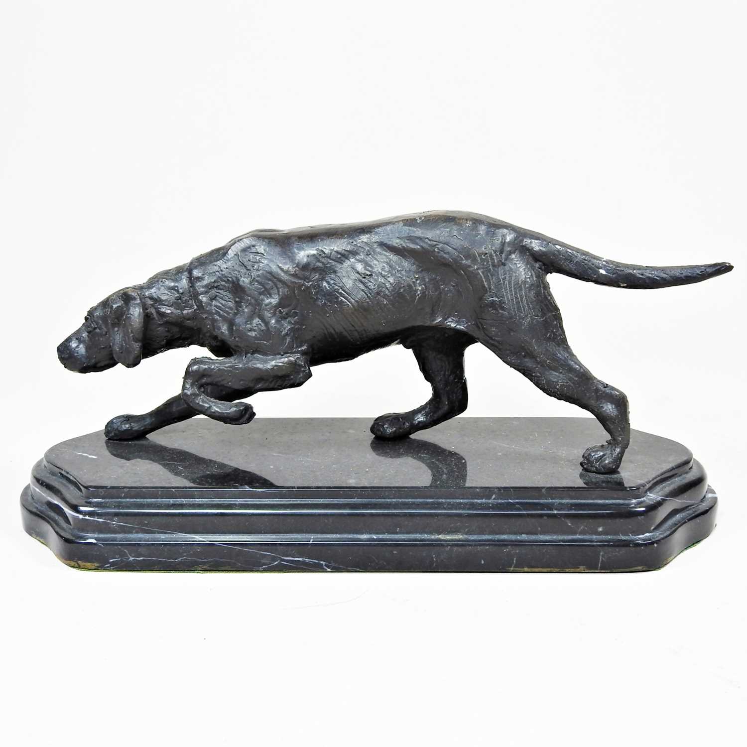 Lot 39 - A bronze model of a dog, on a marble plinth,